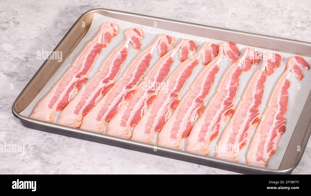 Step by step. Uncooked bacon strips on a baking sheet with white ...