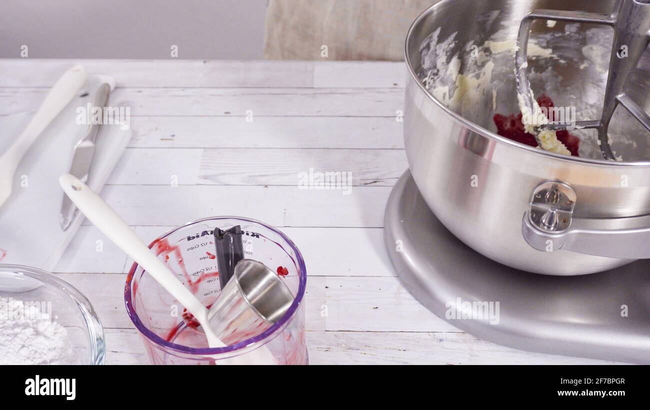 Preparing raspberry cream cheese buttercream in kitchen mixer for bake ...