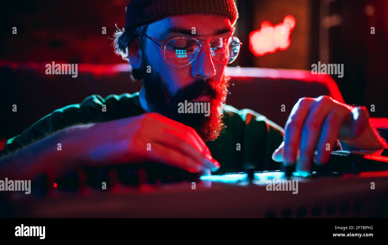 Close-up of musician performing in neon light. Concept of advertising ...