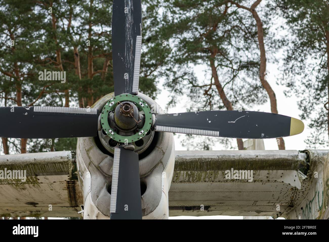 Propeller on a propeller engine with trees in the background, broken ...
