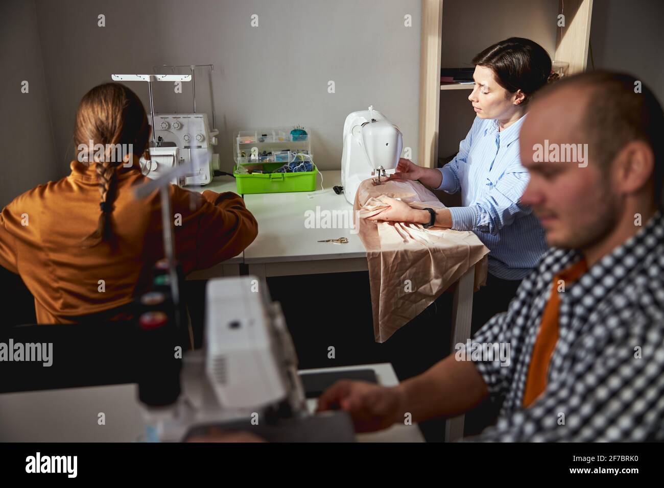 Women stitching clothes hi-res stock photography and images - Alamy