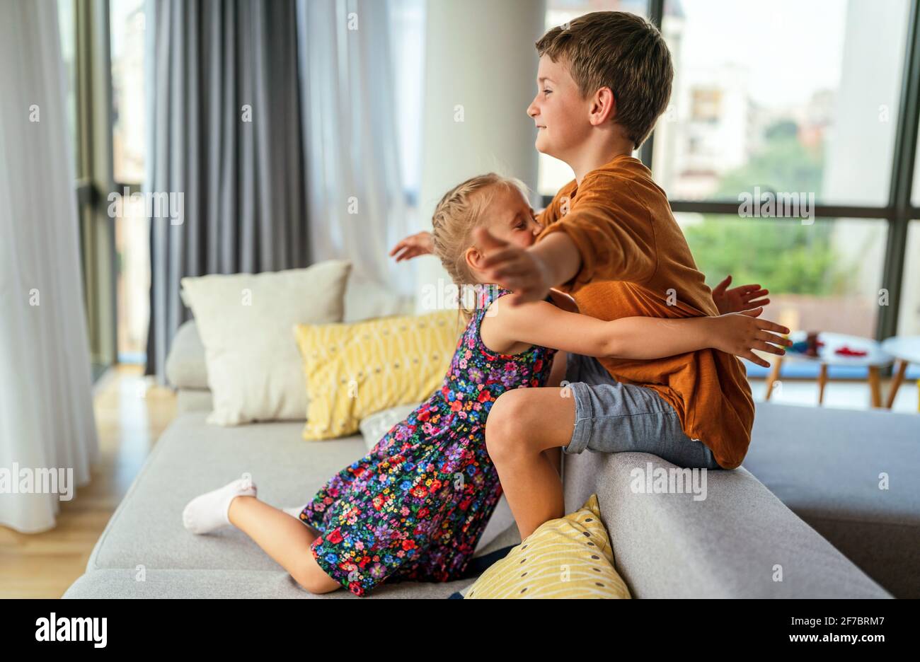 Little kids, siblings hug and cuddle at home show love and care. Family ...