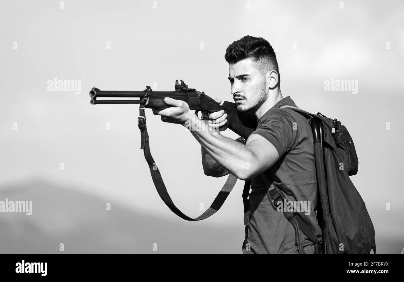 Hunter handsome guy with weapon. Hunter spend leisure hunting. Hunting ...