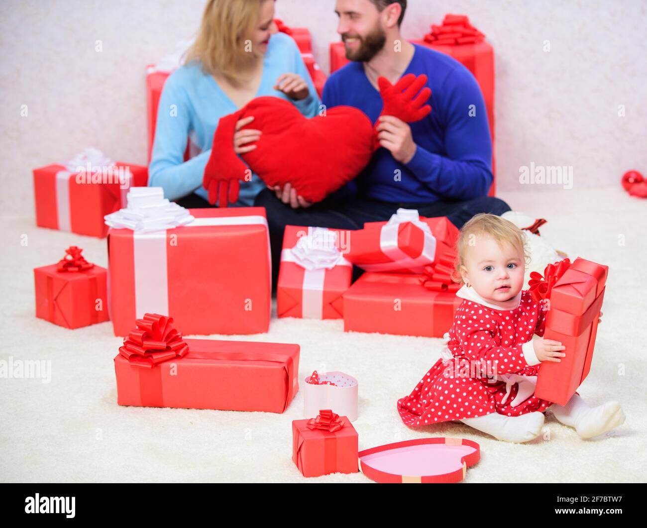 Celebrate valentines day. Couple in love with baby toddler celebrate ...