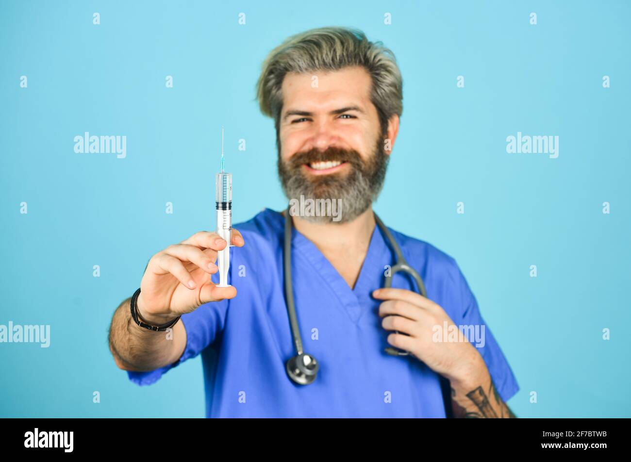 Medical injection. Bearded doctor wear uniform use syringe needle ...