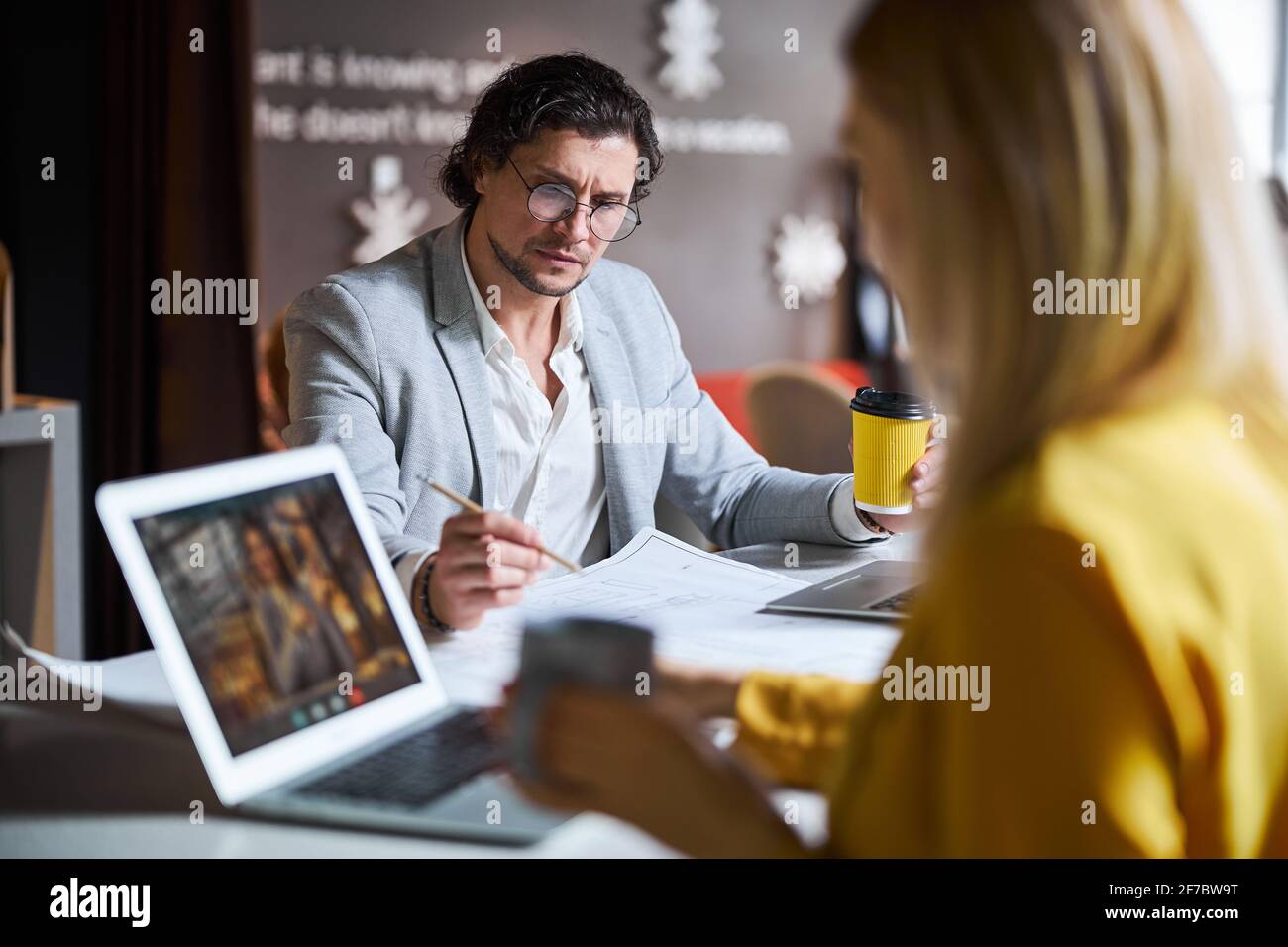 Serious brunette man being deep in his thoughts Stock Photo - Alamy