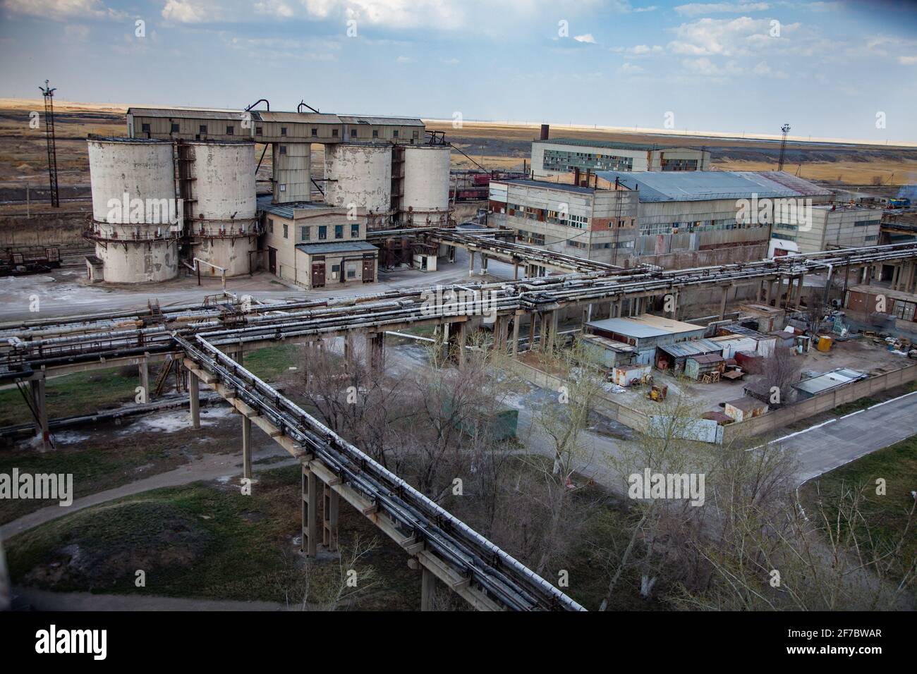 Outdated Soviet mining and processing plant. Concrete elevator and ...