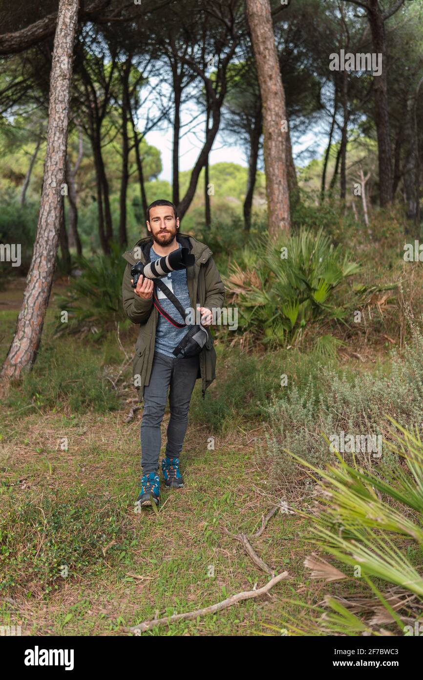 Photographer walking with his DSLR camera in the countryside Stock ...