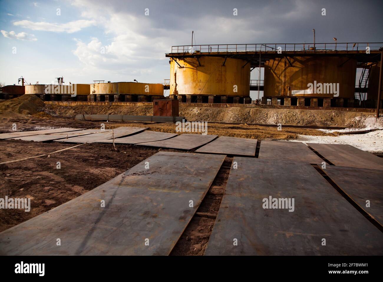 Demolition of outdated Soviet sulfuric acid plant.Old rusted yellow ...