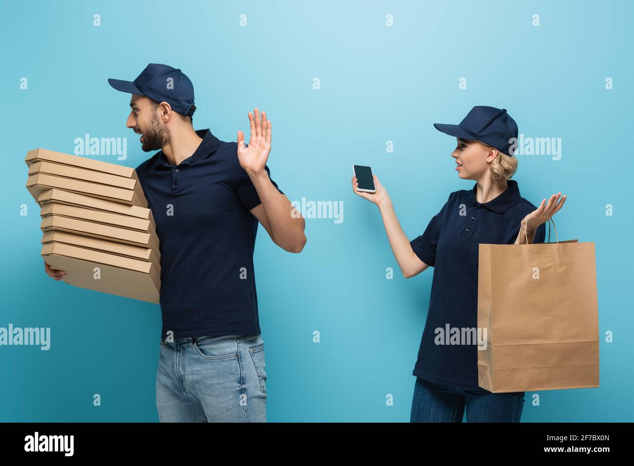 arabian delivery man showing refuse gesture near courier holding ...
