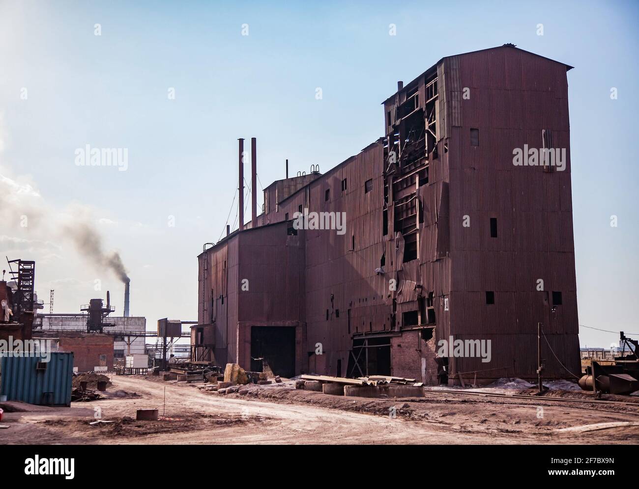 Demolition of outdated Soviet sulfuric acid plant industrial building ...
