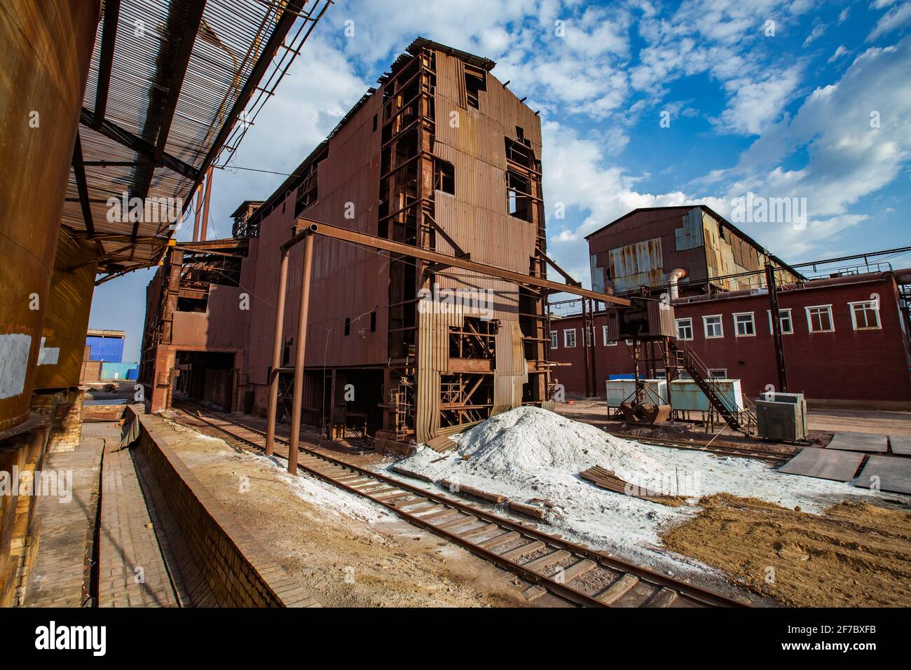 Demolition of outdated Soviet sulfuric acid plant industrial building ...