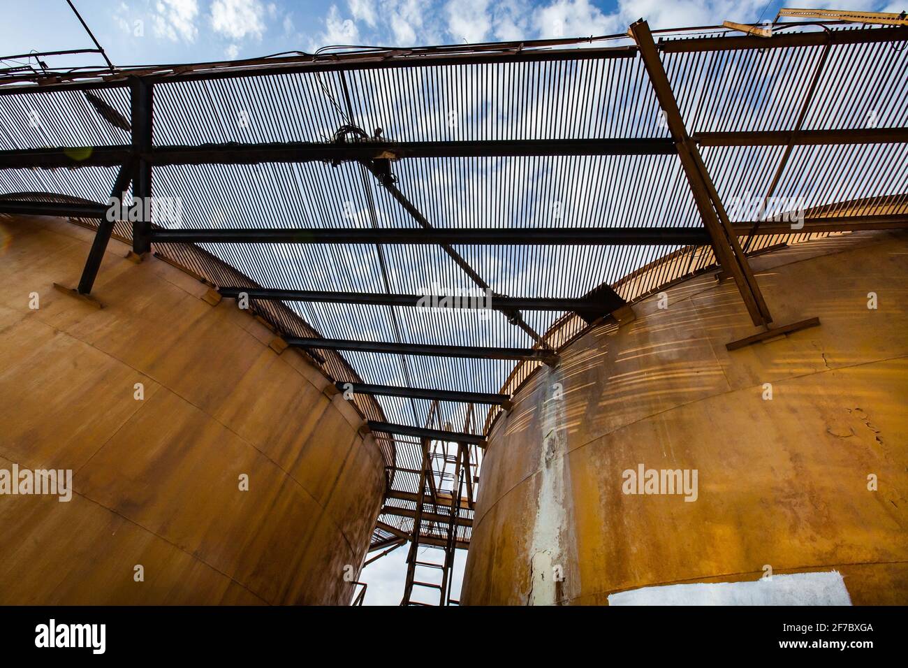 Demolition of outdated Soviet sulfuric acid plant.Old rusted yellow ...