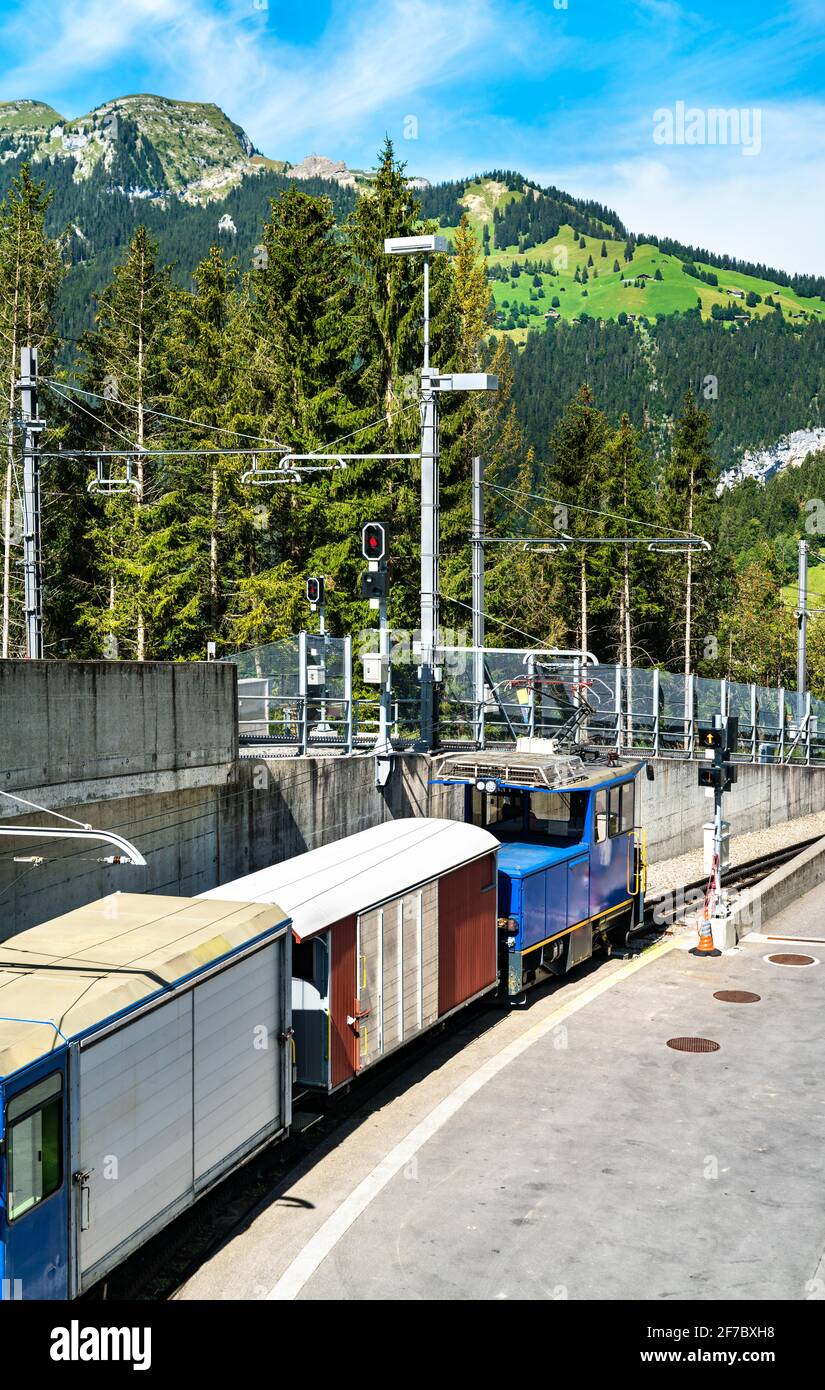 Freight train at Wengen railway station in Switzerland Stock Photo - Alamy