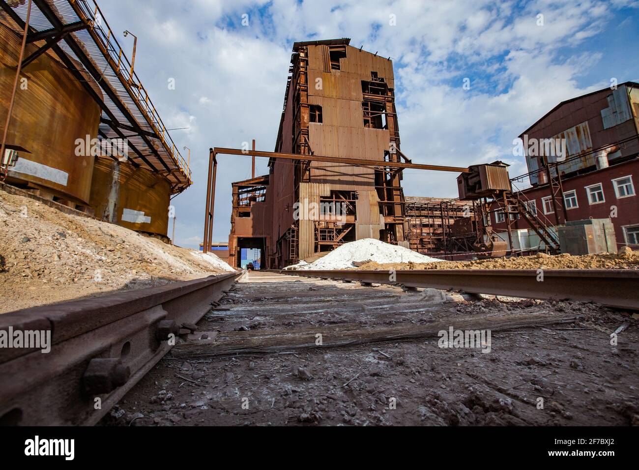 Demolition of outdated Soviet sulfuric acid plant industrial building ...
