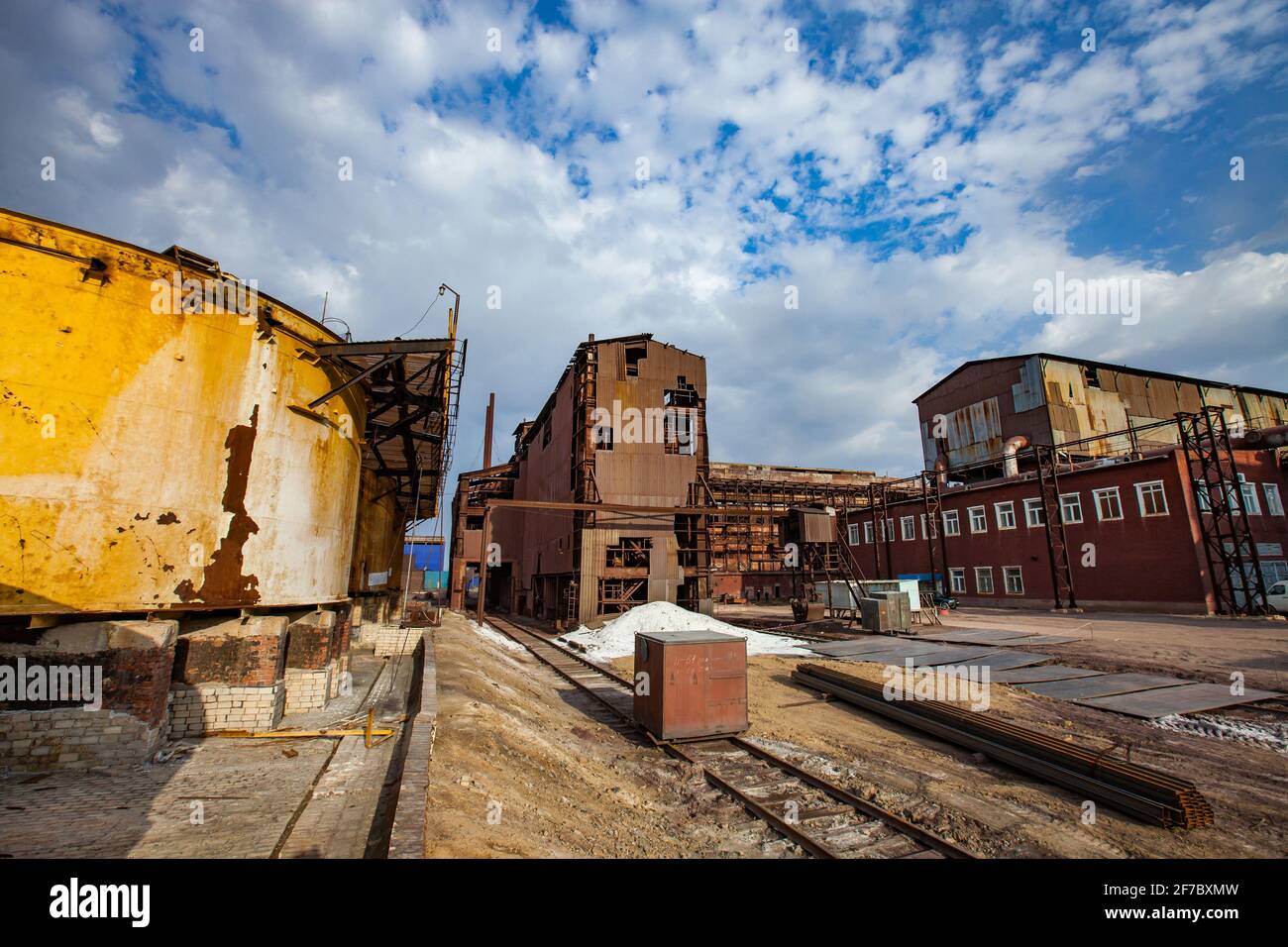 Demolition of outdated Soviet sulfuric acid plant industrial building ...