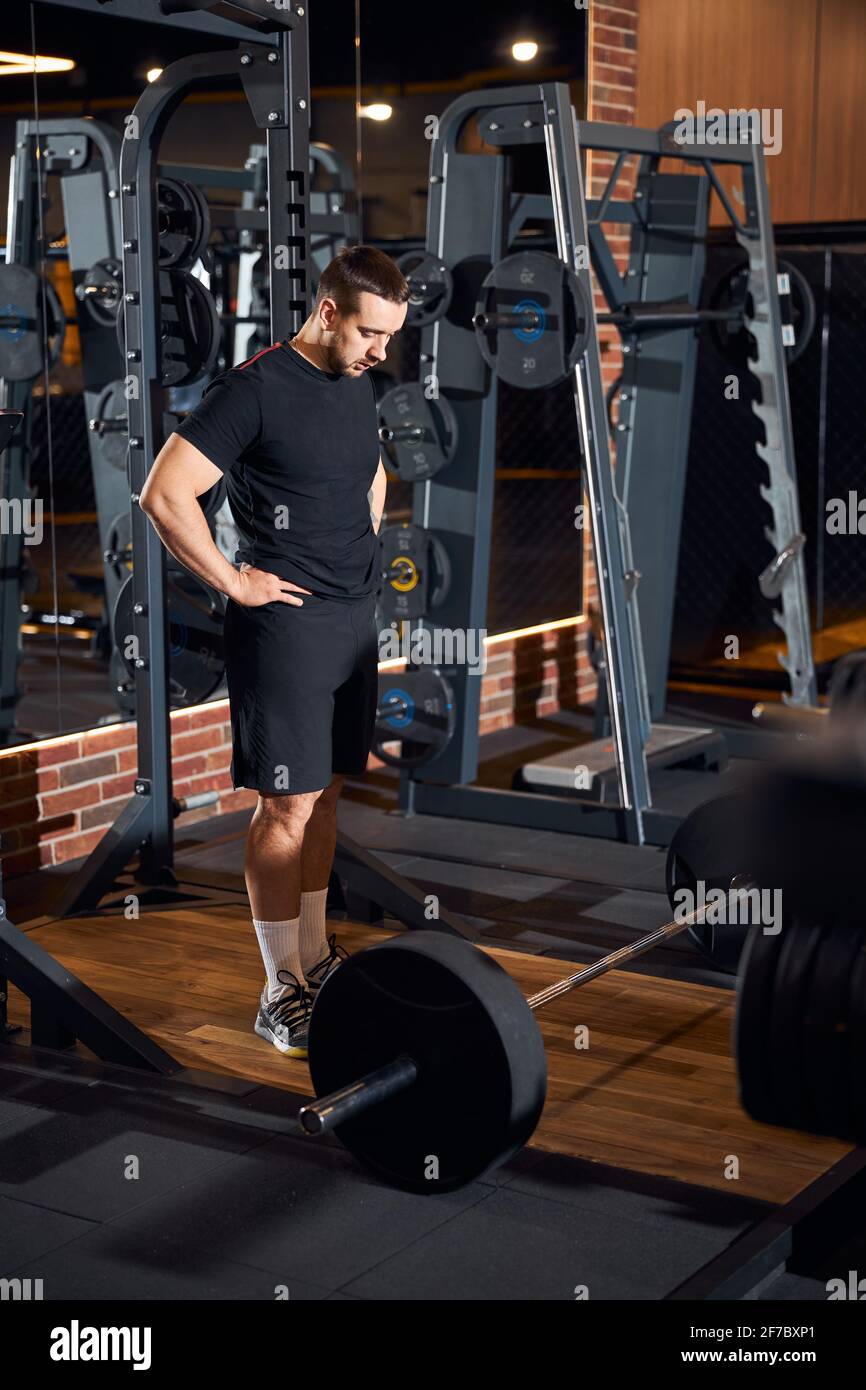 Brunette sportsman getting ready to lift weights Stock Photo - Alamy