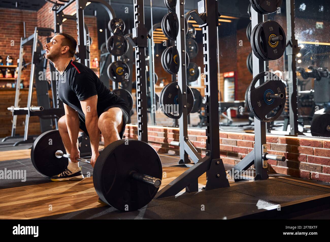 Athlete straining lifting weights hi-res stock photography and images ...