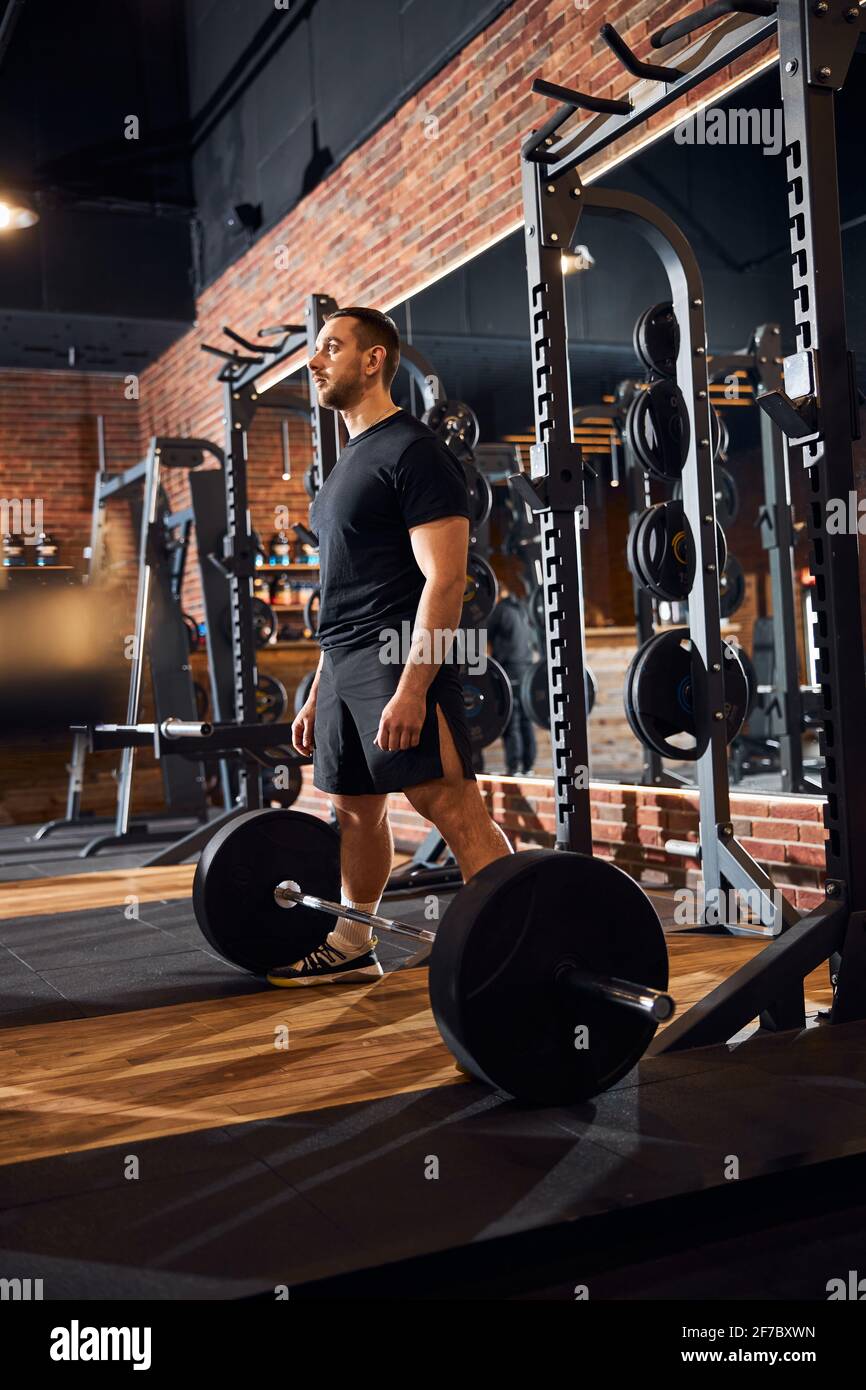 Athlete straining lifting weights hi-res stock photography and images ...