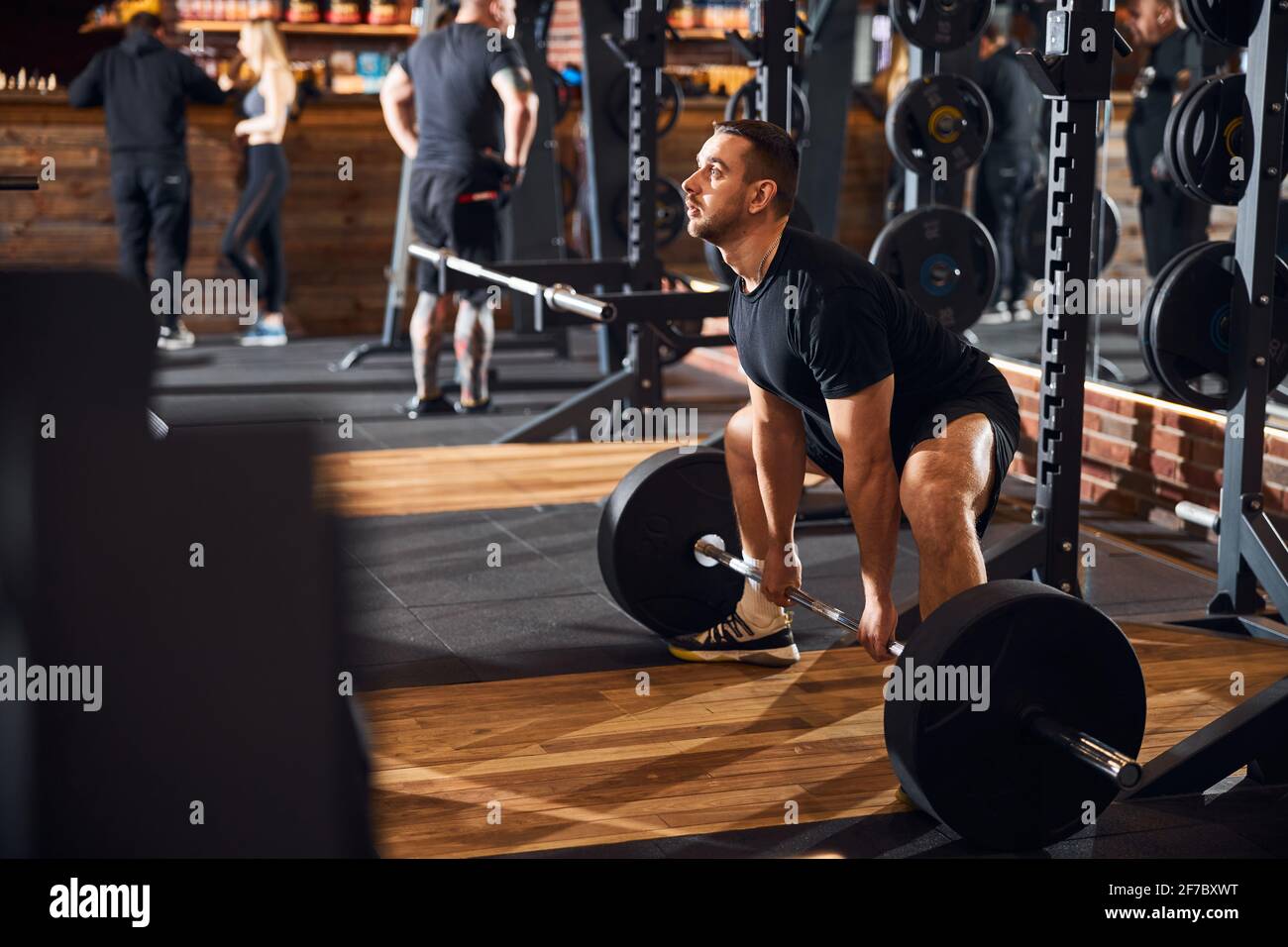 Athlete straining lifting weights hi-res stock photography and images ...