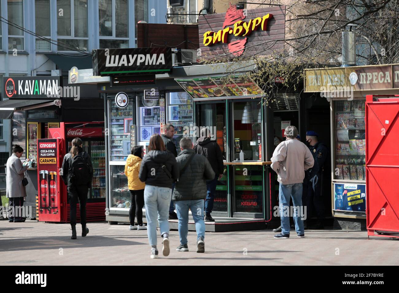KYIV, UKRAINE - APRIL 6, 2021 - People queue at a food stall as COVID ...