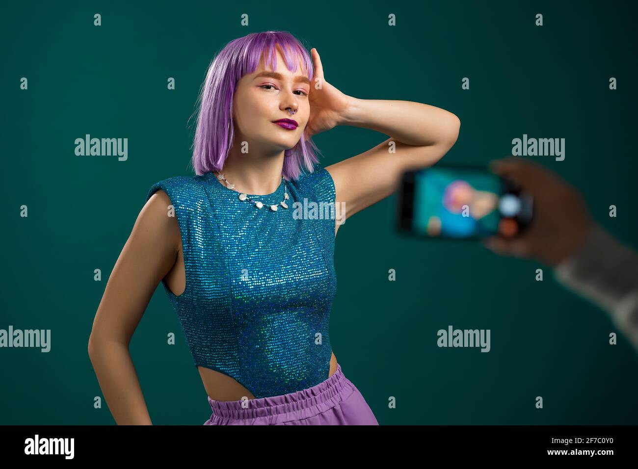 Smiling vlogger hipster woman recording video of herself dancing in ...