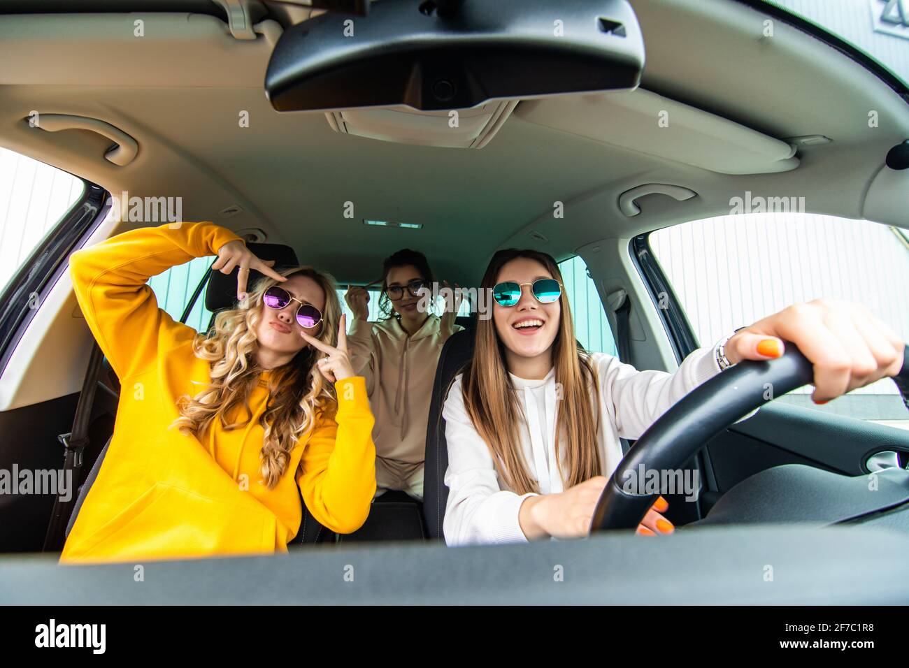 Group Of Girls Having Fun In The Car Women Friends Singing Songs And