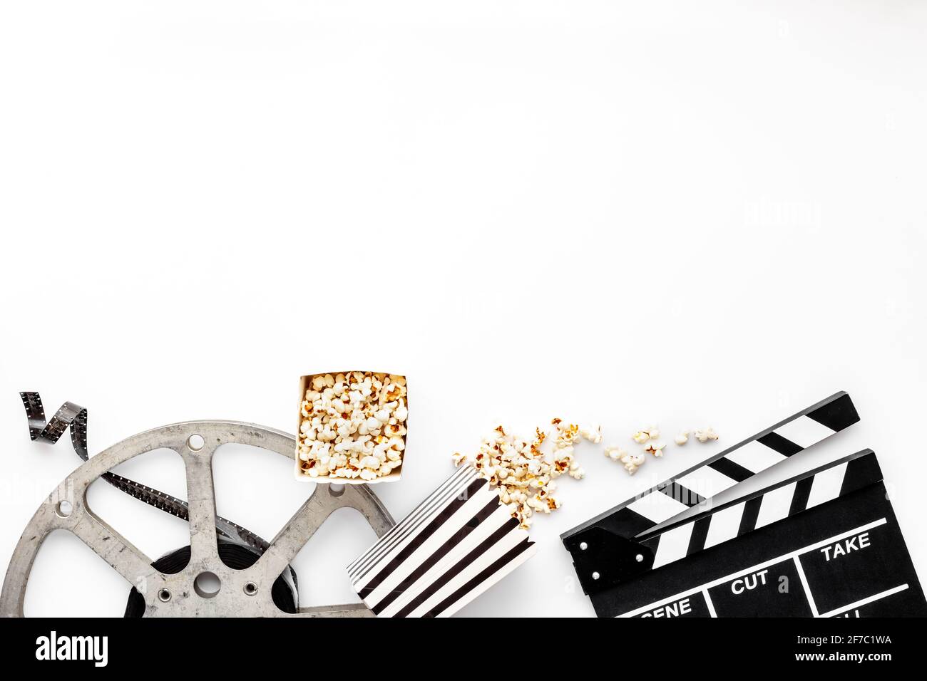Layout of film reel with popcorn and clapperboard. Cinema concept Stock ...