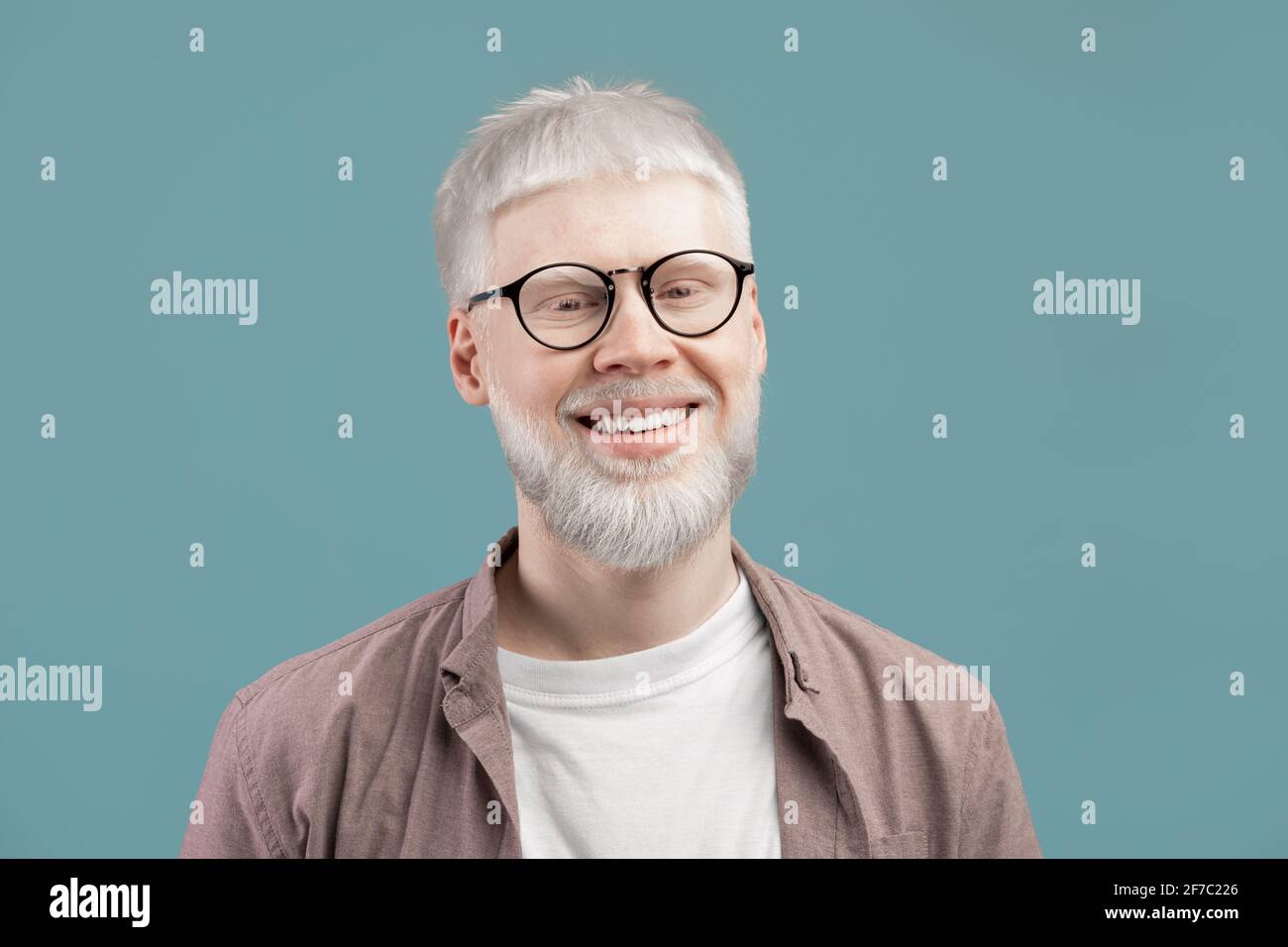 Headshot portrait of happy man with pale skin wearing eyeglasses ...