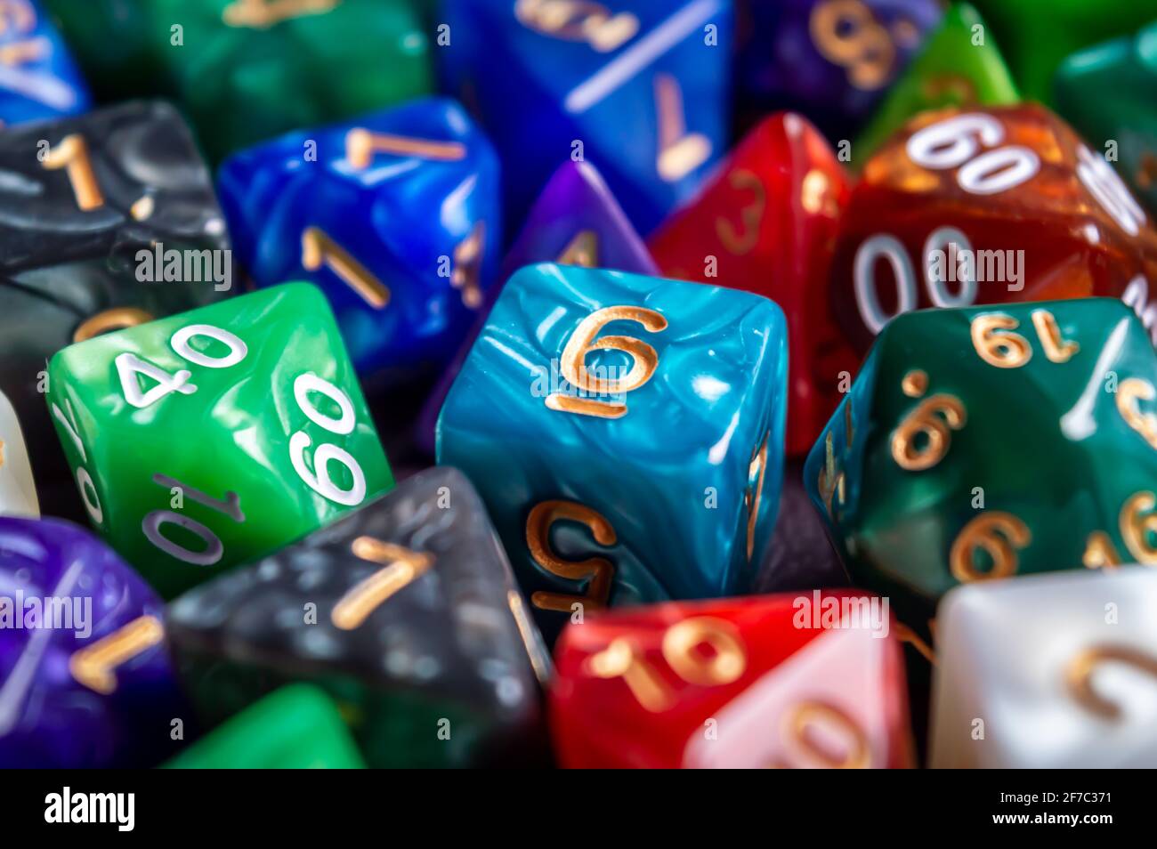 Image of a marbled turquoise 6 sided die surrounded by multiple RPG ...