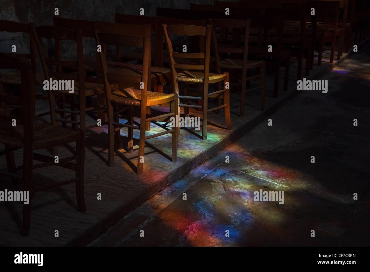 Sunlight filtered through the stained glass window reflected on the ...