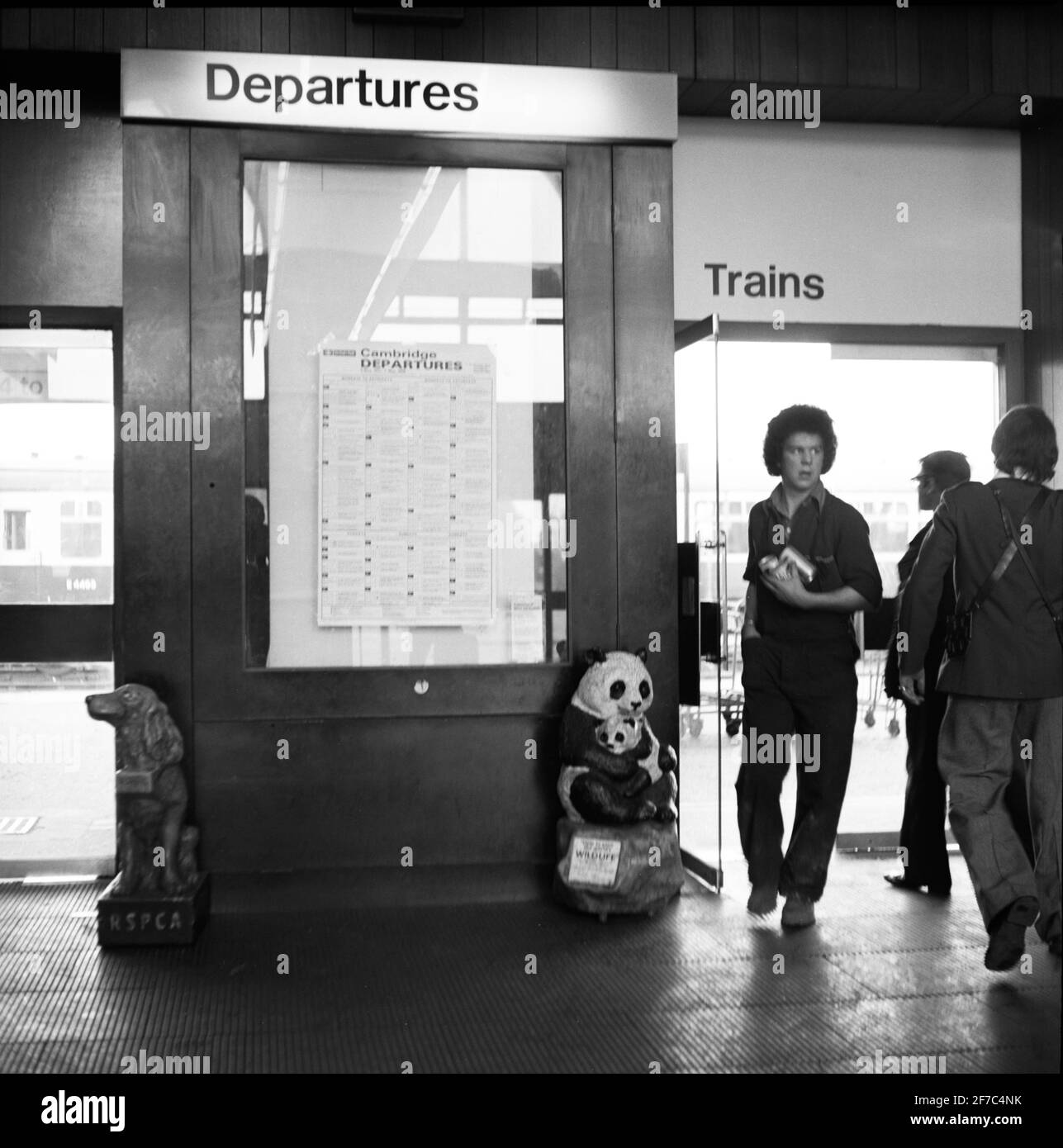 A young man brings cans of beer. Waiting Room, Cambridge Railway ...