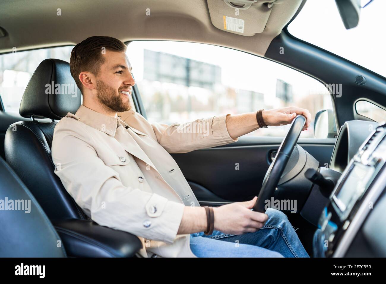 Confident handsome man driving car Stock Photo - Alamy
