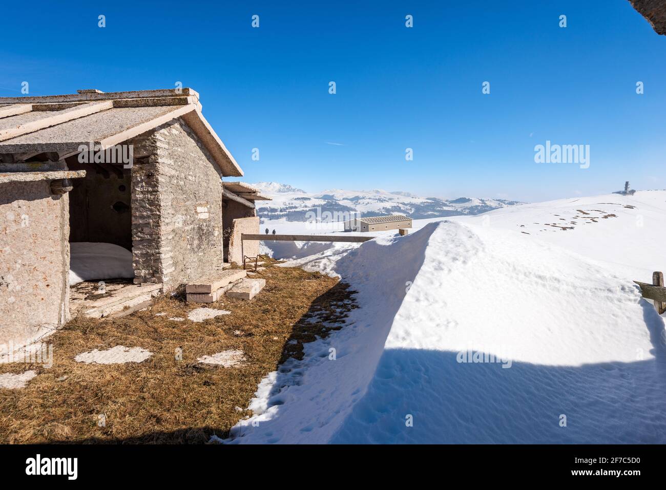 Typical ancient stone cow shed on Lessinia Plateau in winter with snow ...