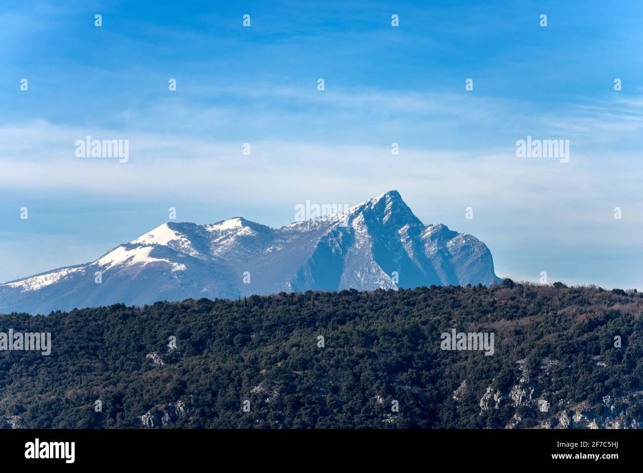 Mountain Peak of Monte Pizzocolo in winter with snow, also called the ...