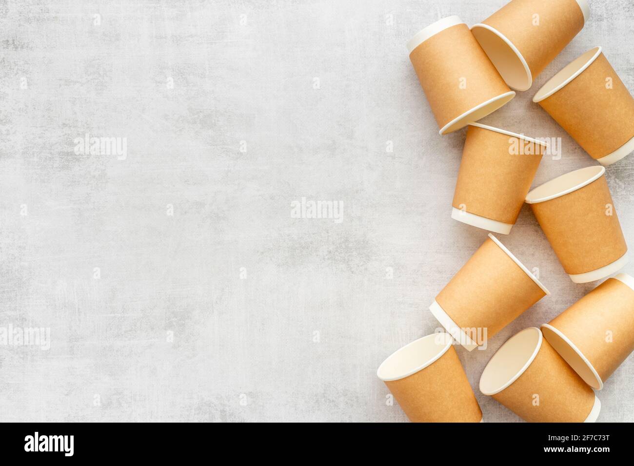 Layout of coffee paper cups. Overhead view Stock Photo - Alamy
