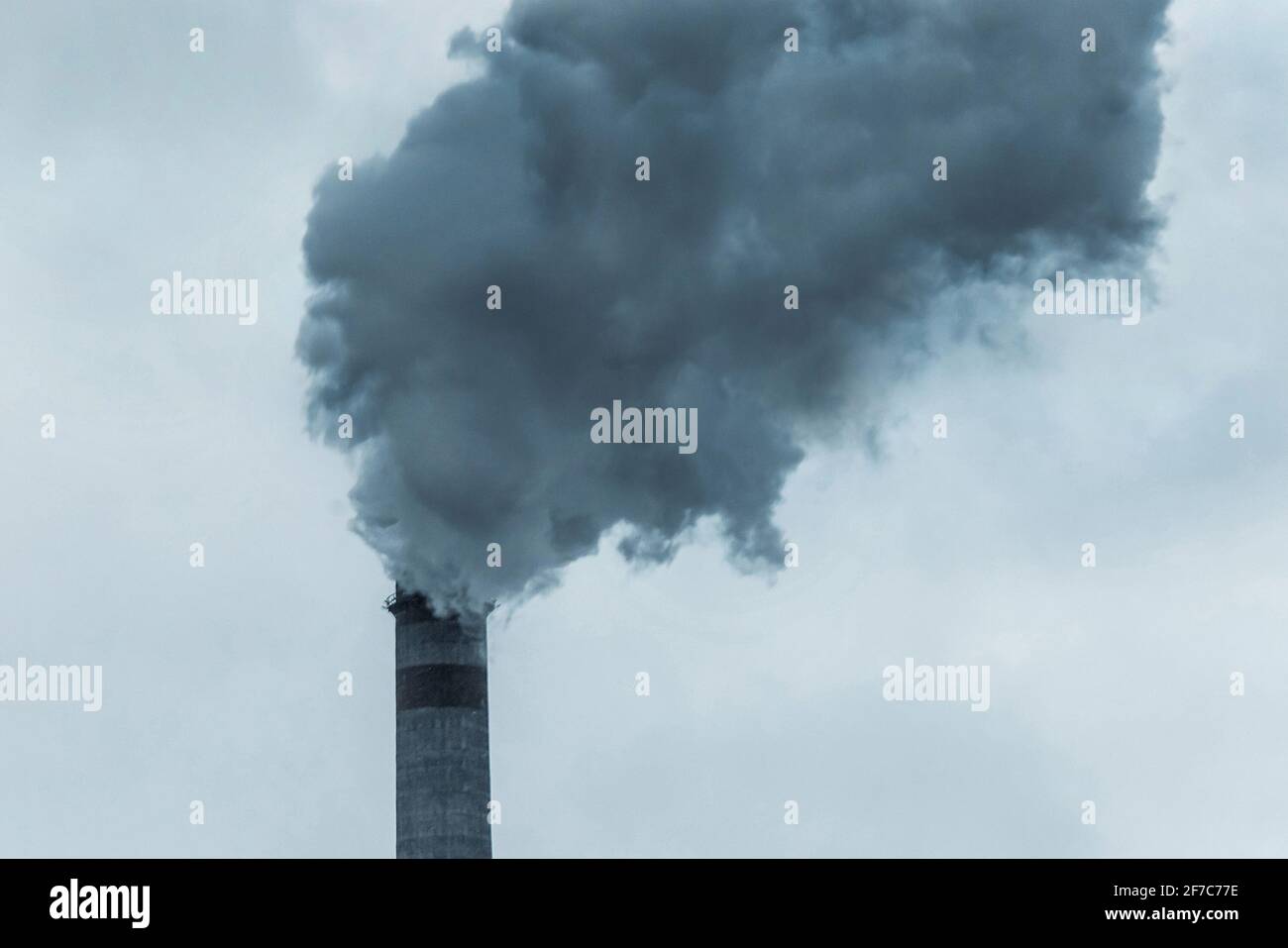 Problems of environmental pollution and ecology. Dark gray acrid smoke ...