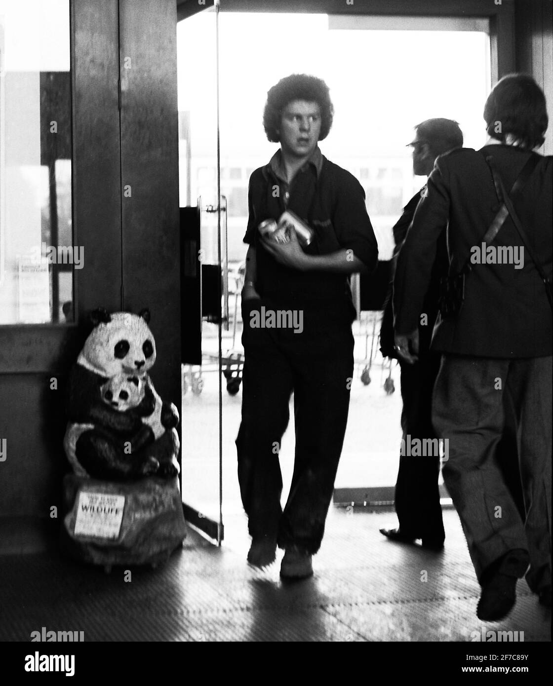 A young man brings cans of beer. Waiting Room, Cambridge Railway ...