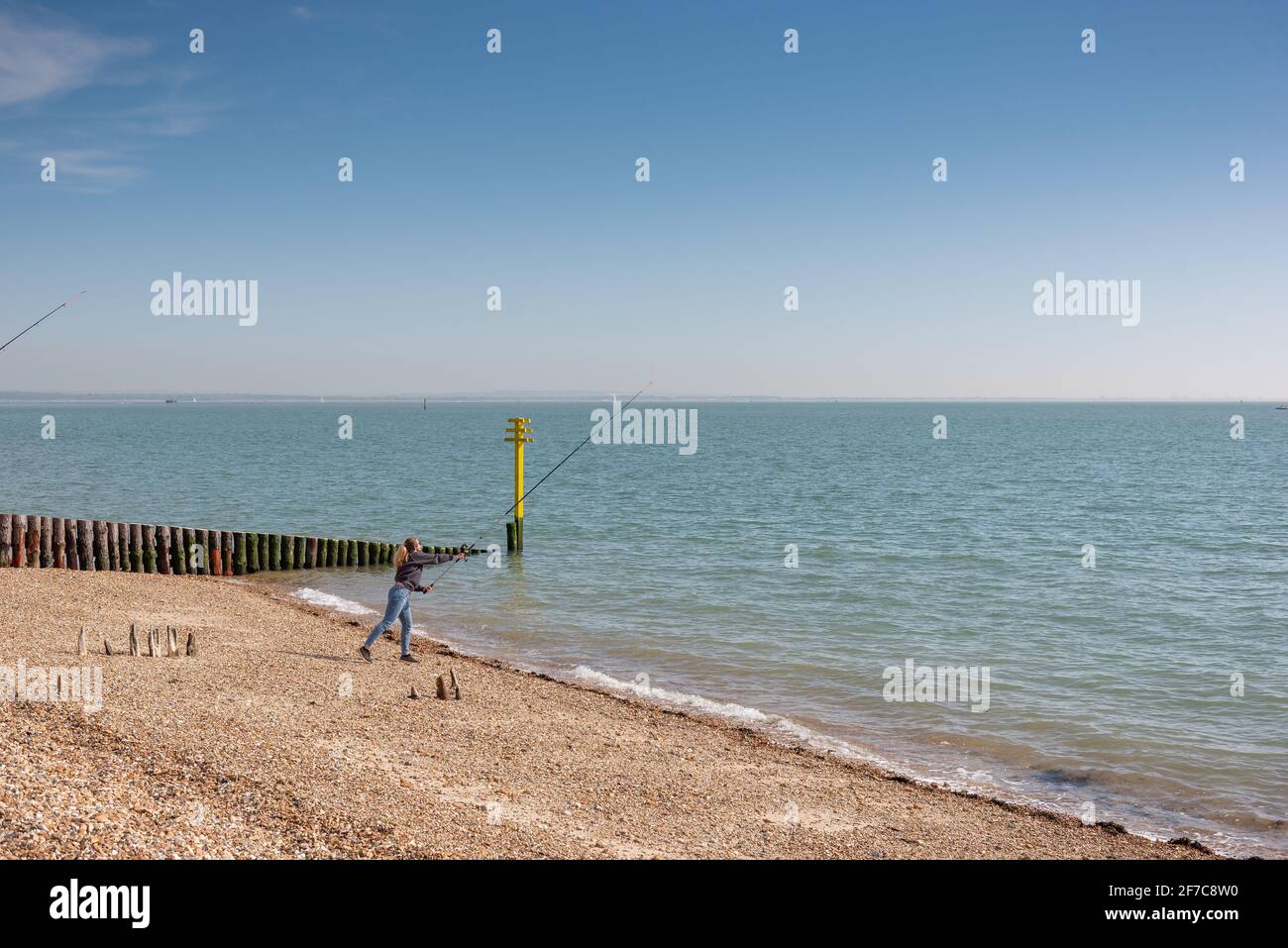 Lady sea fishing on beach Lepe Hampshire Stock Photo - Alamy