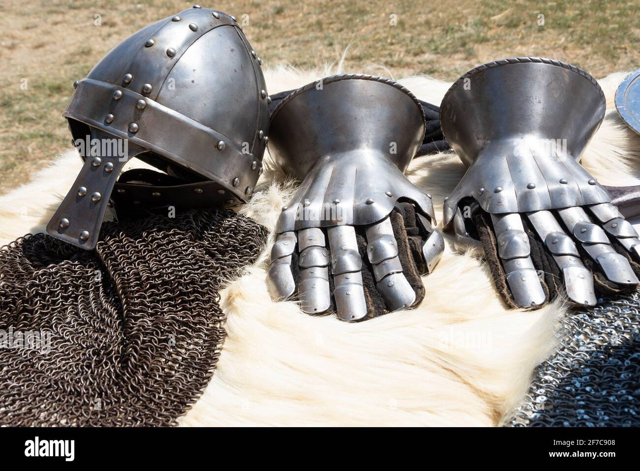 Knight helmet and gauntlets on fur. Middle ages armor still life ...