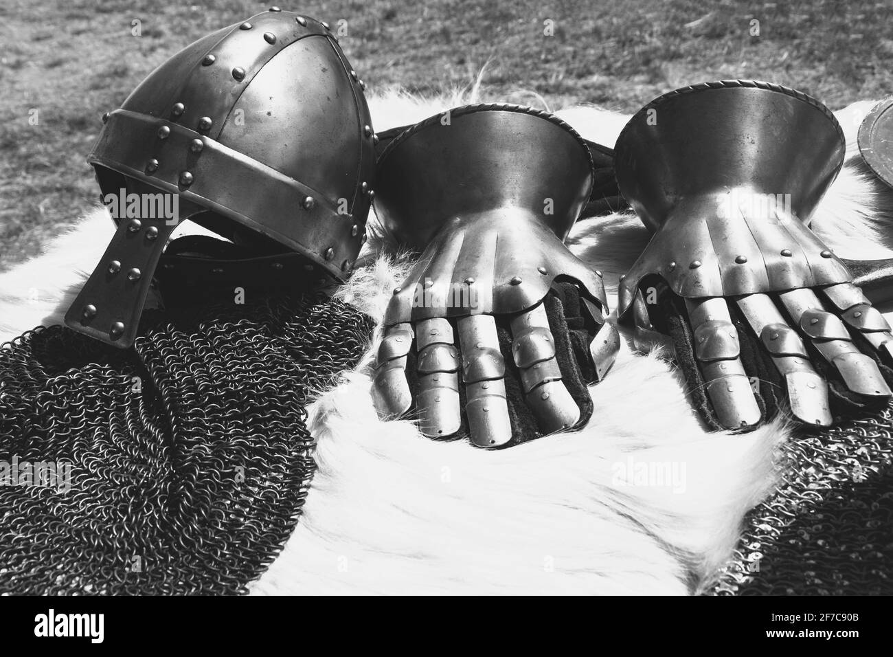 Knight helmet and gauntlets on fur. Middle ages armor still life ...