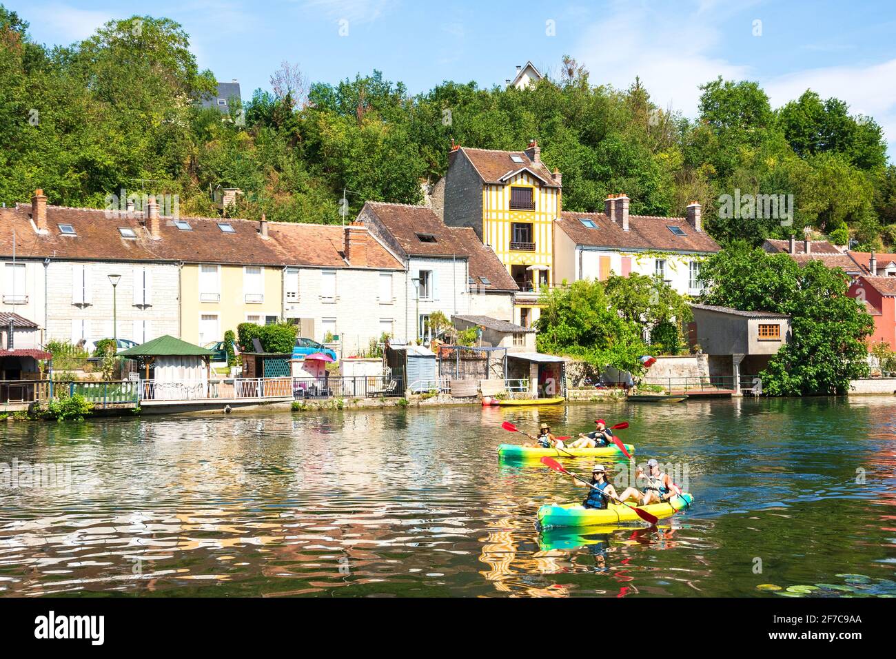 NEMOURS, FRANCE - JULY 7, 2019: People paddling canoe on Loing river ...