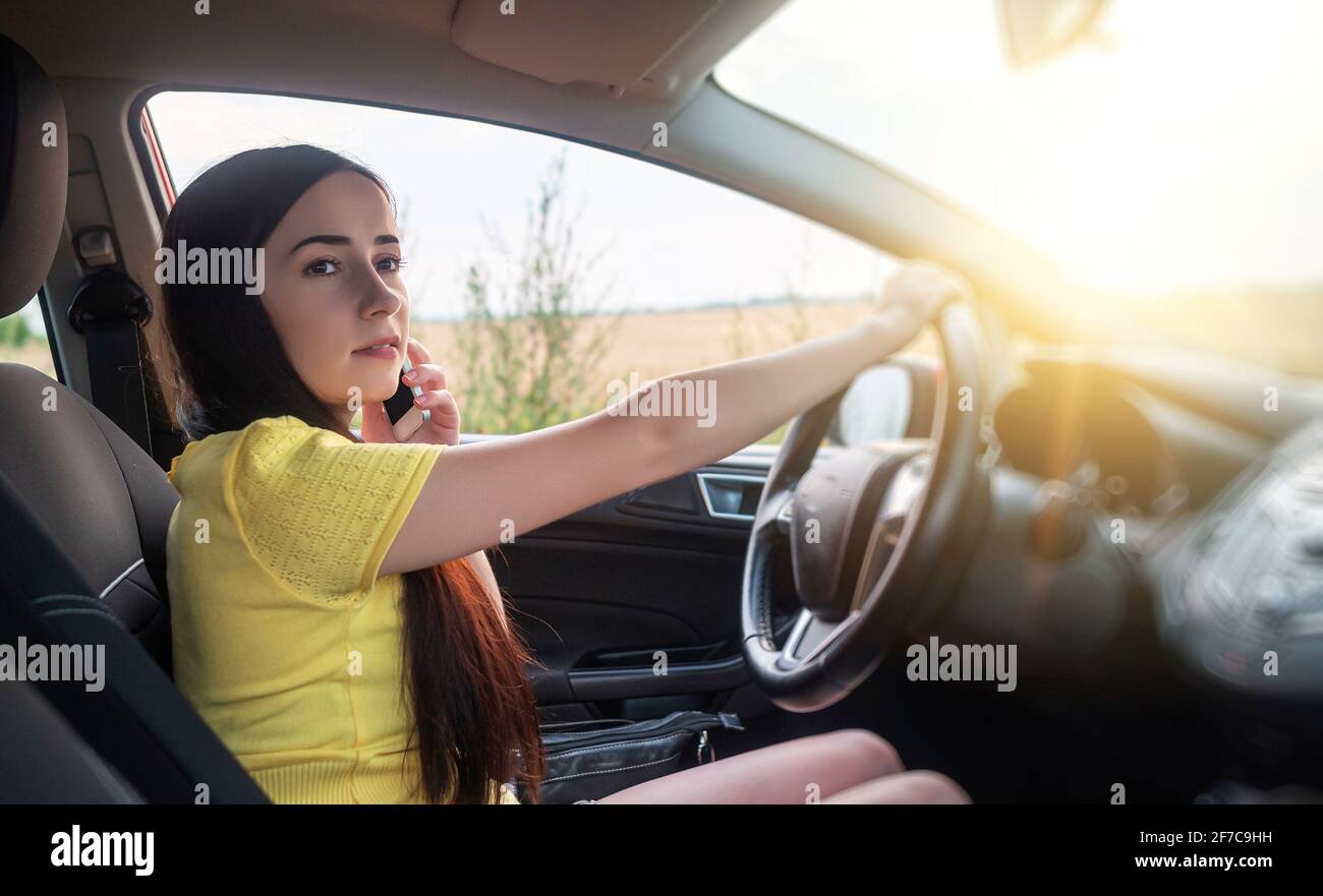 Woman multitasking while driving hi-res stock photography and images ...