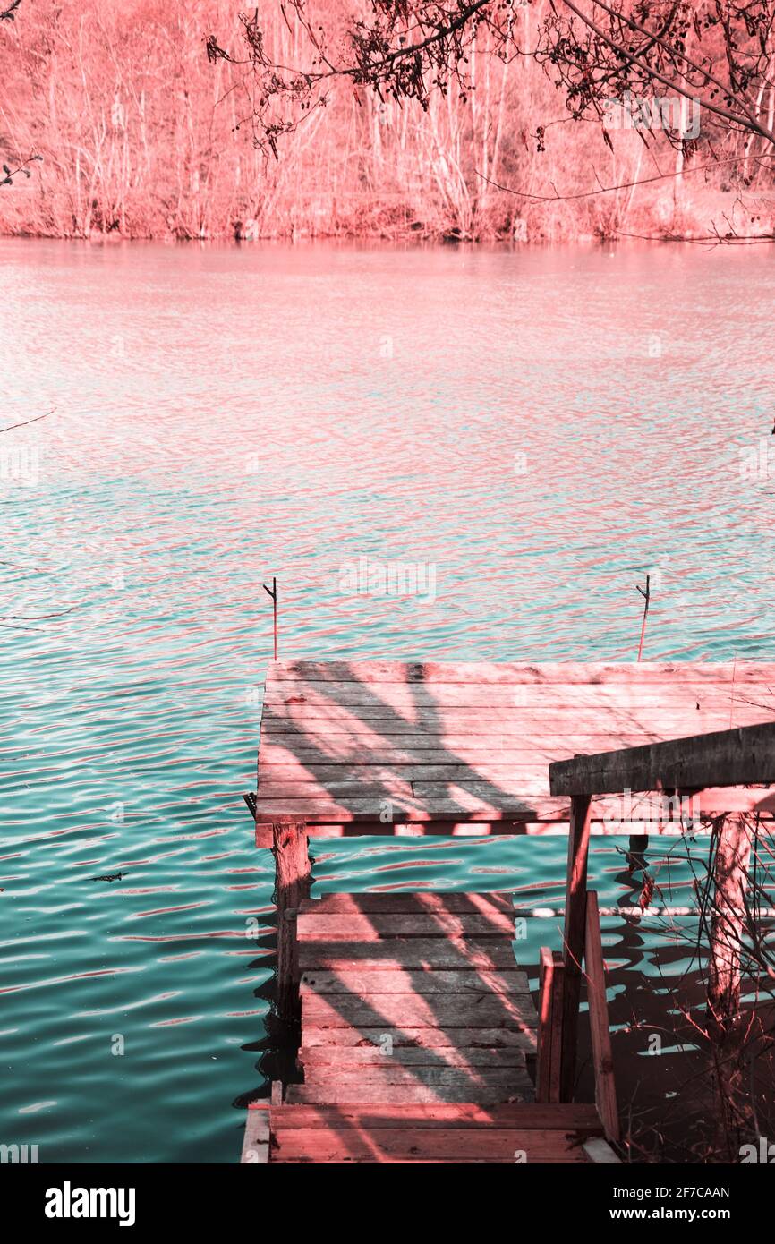 Wooden gangway for fishing in river. Scenic view at sunrise pink soft ...