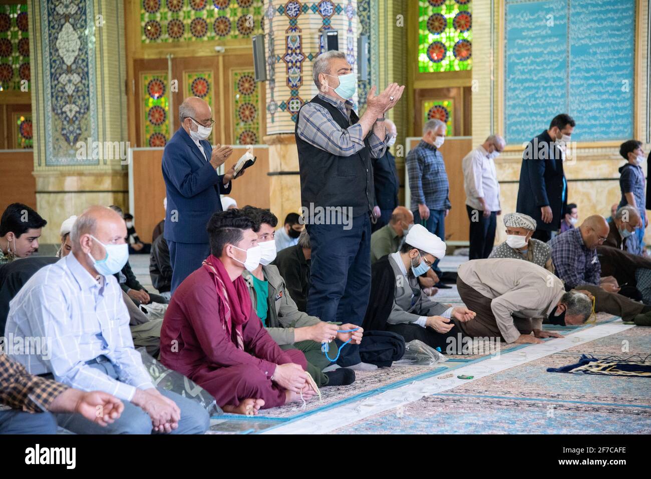 A Iranian man wearing face mask prayer in the Jamkaran Mosque amid the ...