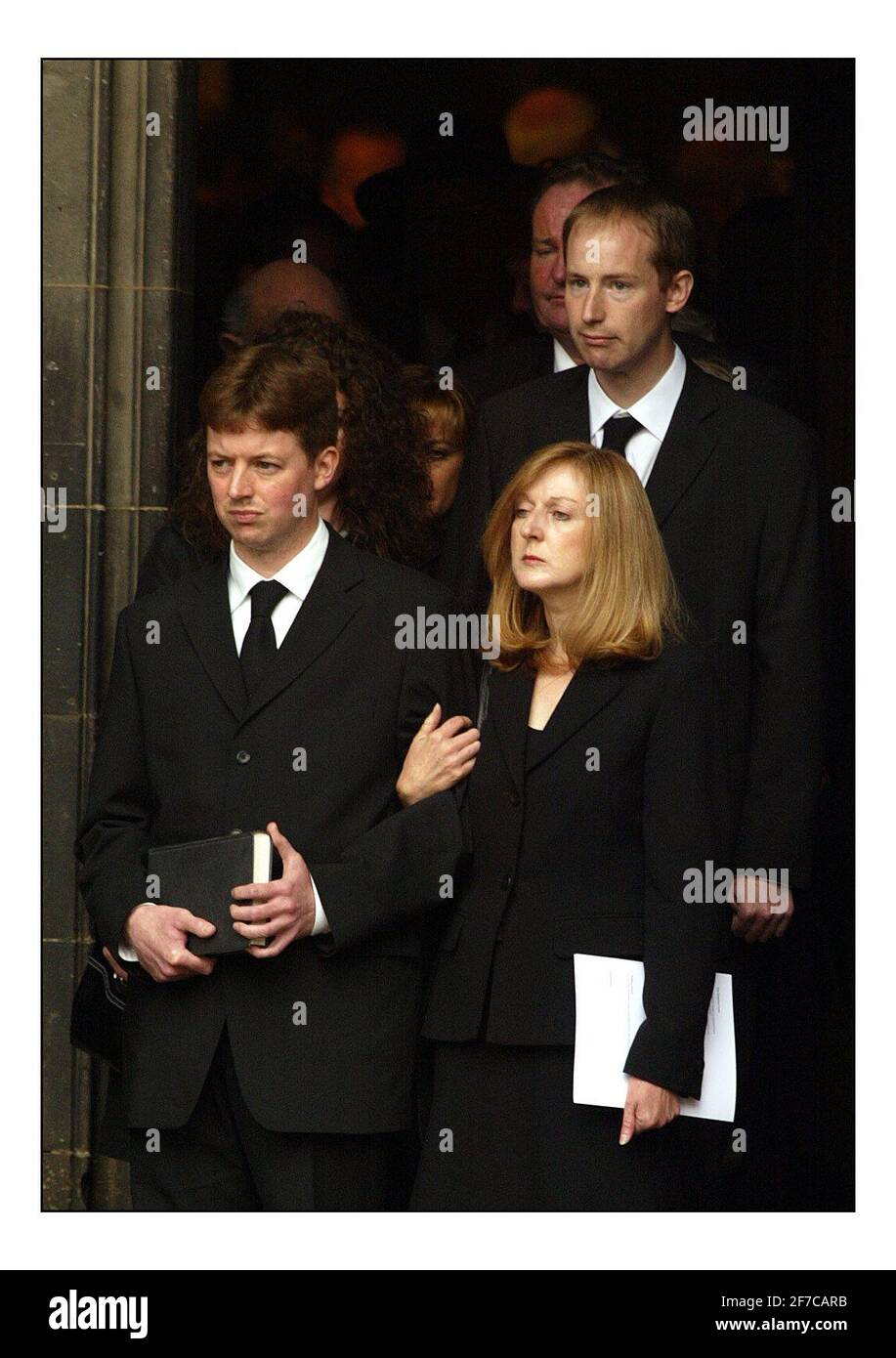 Gaynor Cook with robin cooks son Chris at Robin Cook's Funeral at St ...