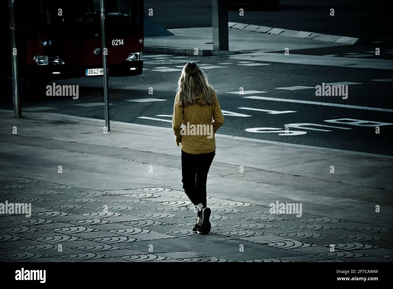Woman Walking Alone In City