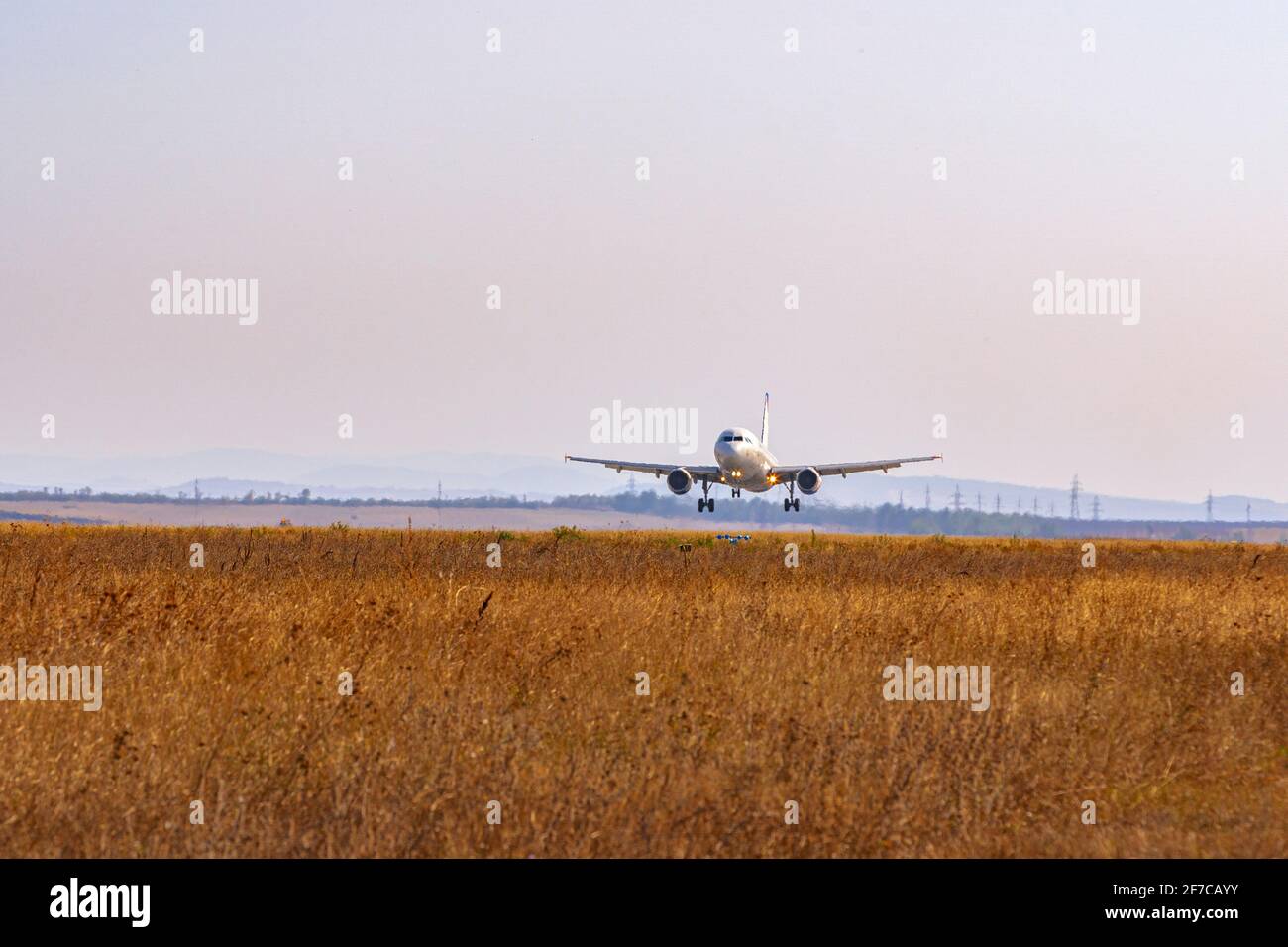 Passenger plane takes off from runway in airport Stock Photo - Alamy
