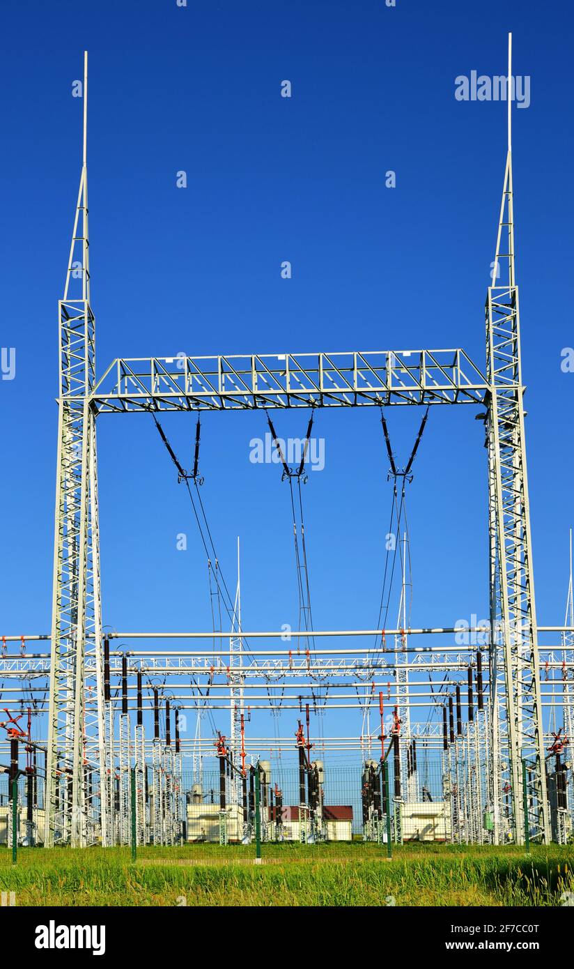 High voltage power substation on blue sky background Stock Photo - Alamy