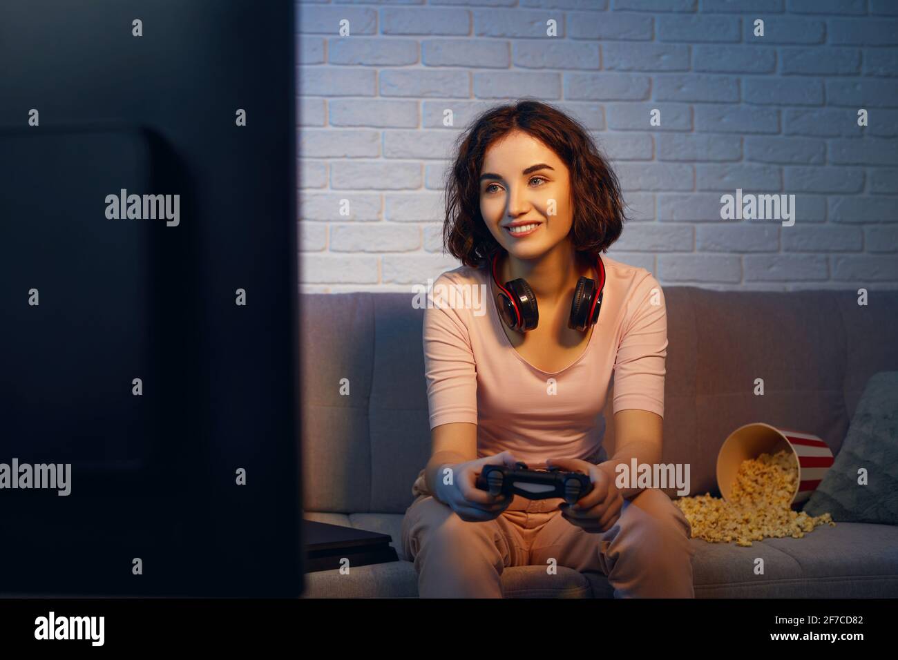 involved gamer girl playing video games on the console Stock Photo - Alamy